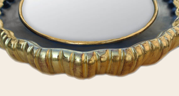 A Clam-shell style oval gallery mirror by ILIAD Design - Iliad